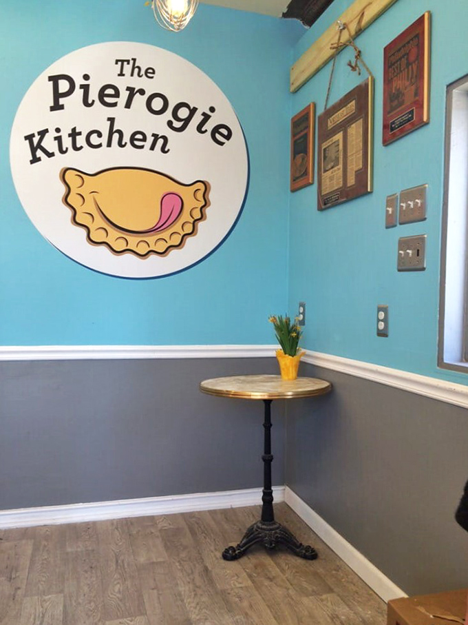 The cheerful logo reminds you that great food doesn't need fancy surroundings to make hearts happy.