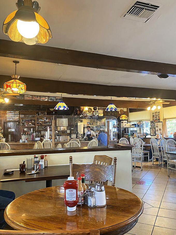 The dining room buzzes with the kind of authentic energy money simply cannot manufacture.