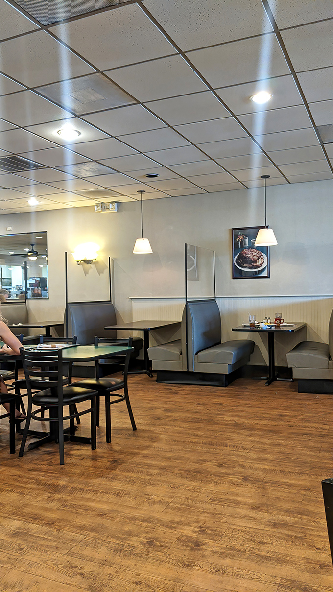 Cozy booths where breakfast dreams come true. That wood-look flooring has seen its share of happy food comas.