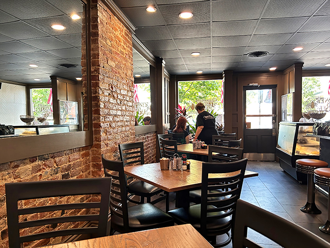 Exposed brick walls meet comfortable seating—where history and hunger find common ground in downtown Gettysburg's favorite local haunt.