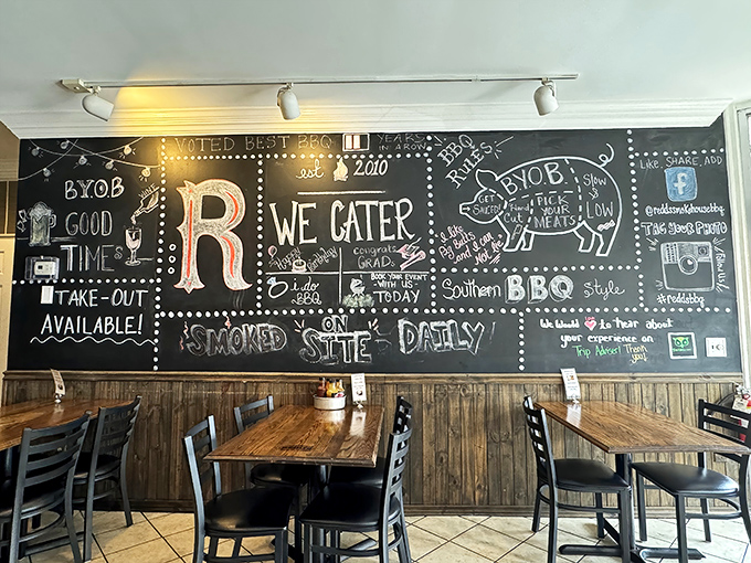 
That chalkboard wall isn't just decoration &ndash; it's a manifesto of smoke and fire, complete with a pig diagram that's both educational and hunger-inducing.