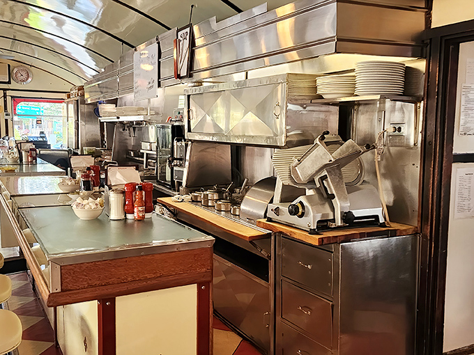 The kitchen ballet unfolds behind stainless steel, where decades of breakfast wisdom transforms simple ingredients into morning masterpieces.