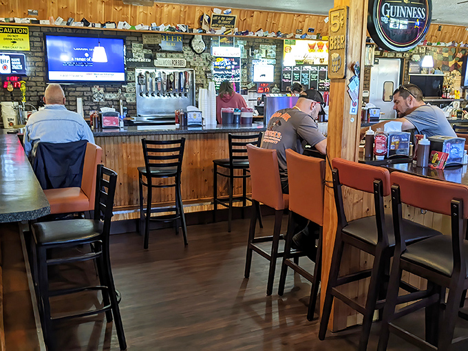A bar where everybody might not know your name yet, but they'll remember your order. Wood paneling and Guinness signs—the universal language of "stay awhile."