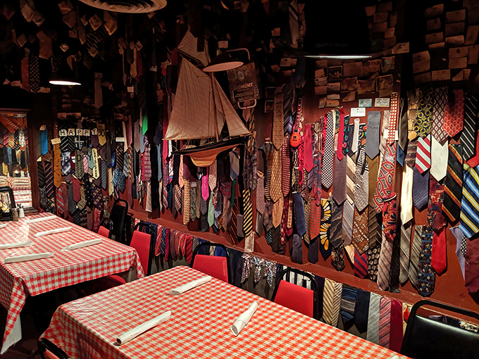The tie collection adorning the walls tells the story: formality checked at the door, replaced by red-checkered tablecloths and honest food.