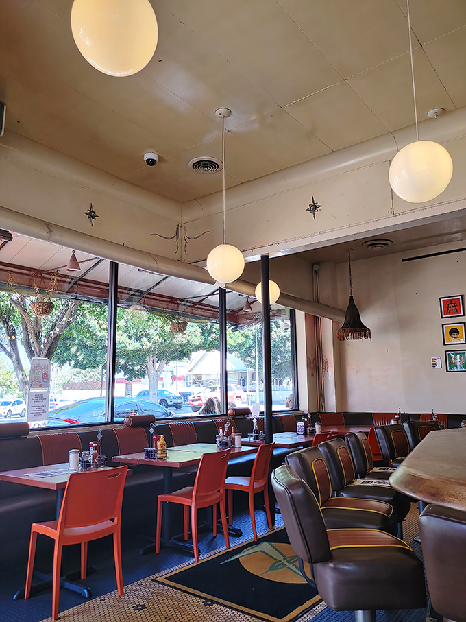 The dining room hums with that perfect diner energy where strangers become temporary neighbors over coffee.
