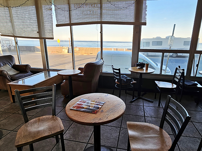 The cafe's panoramic windows frame the Pacific like a living painting, turning every table into oceanfront property for the price of a cup of coffee.