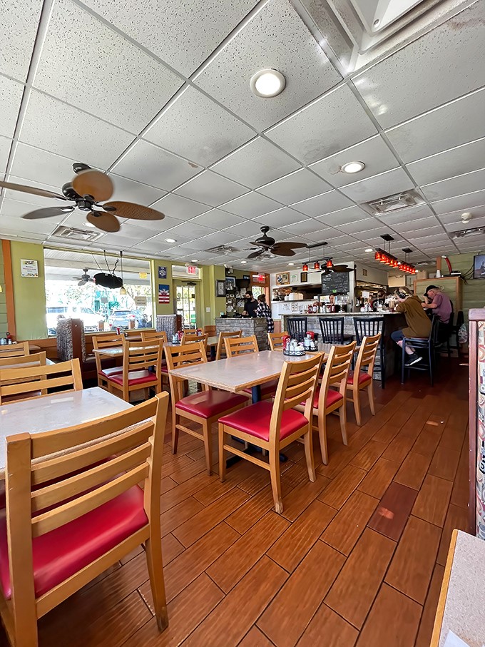 The ceiling fans lazily spin overhead while wooden chairs await the morning rush. This isn't just a restaurant&mdash;it's Orlando's living room.