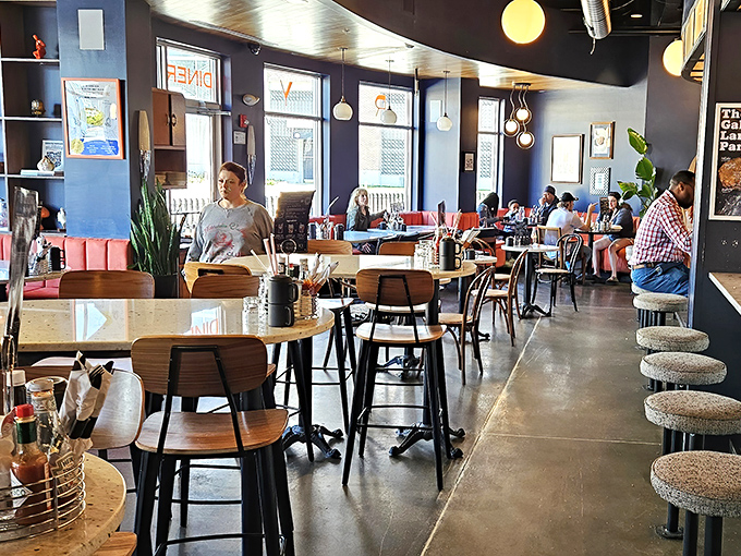 The dining room feels like the mess hall on a particularly stylish space station&mdash;navy walls, yellow lighting, and conversations floating through the atmosphere.