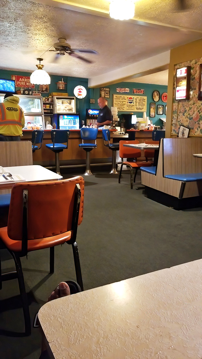 The counter seating&mdash;where solo diners become regulars, and regulars become family in this teal-walled temple of breakfast devotion.