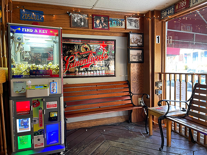 The entryway's wood-paneled charm, complete with claw machine and bench seating, sets the stage for the delicious drama about to unfold.