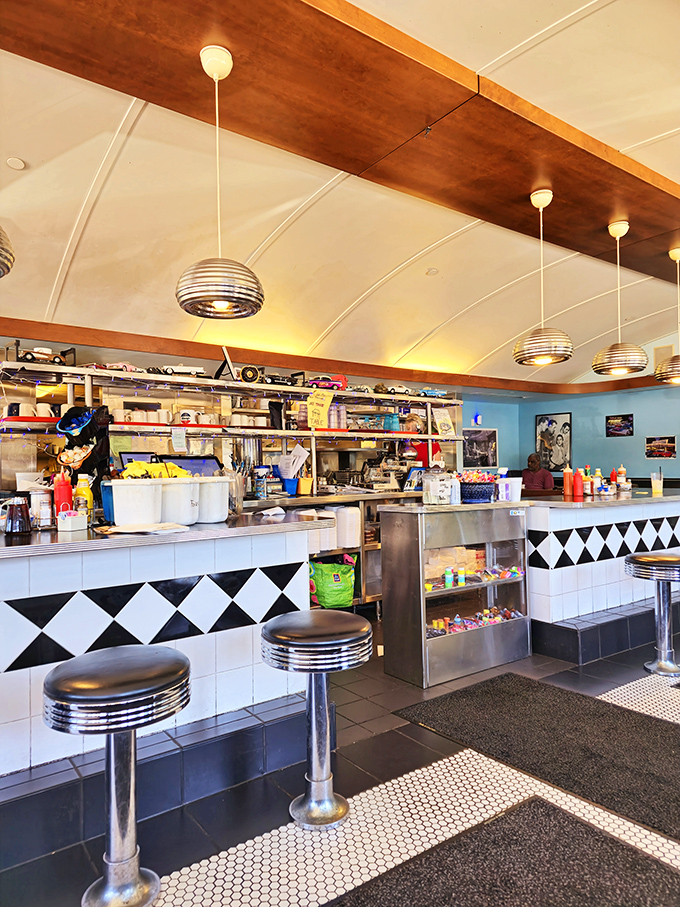 The counter and kitchen view&mdash;where breakfast magic happens under spherical pendant lights that look like they're from The Jetsons.