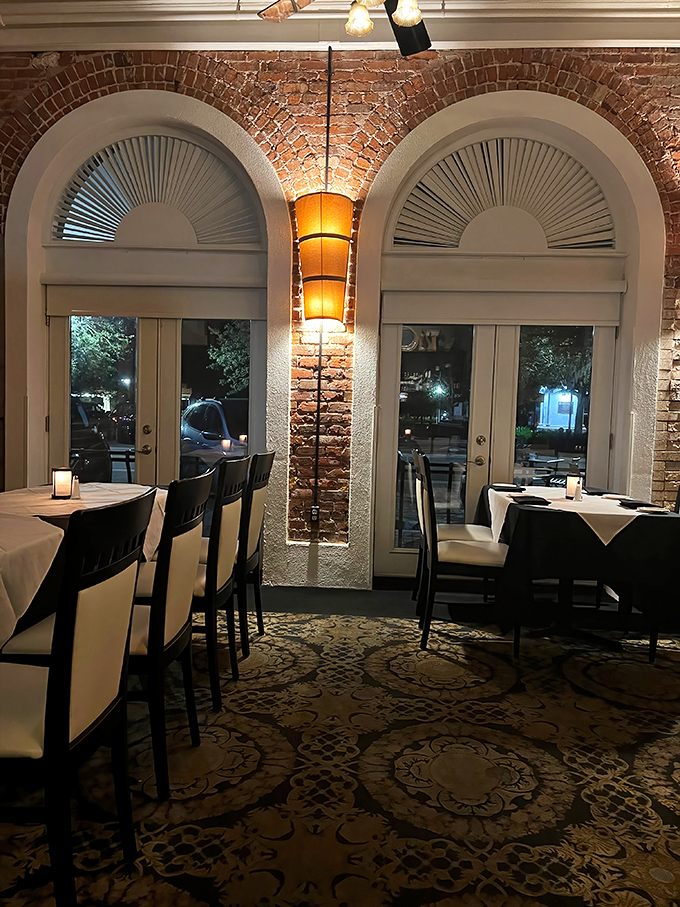 Arched windows, exposed brick, and perfect lighting create the kind of dining room where you'll want to linger long after the tiramisu is gone.