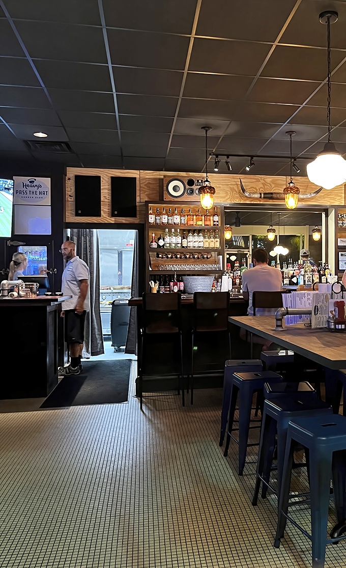 Heavy's bar isn't just serving drinks&mdash;it's serving possibilities. Those pendant lights cast the perfect glow for making important decisions like "another round?"