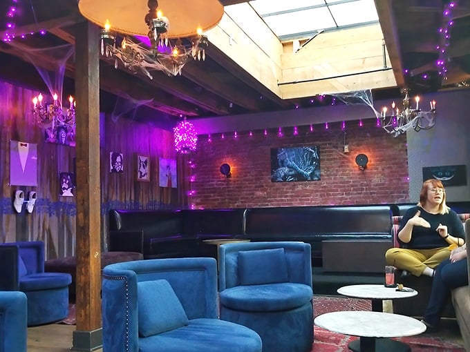 Cobwebs, chandeliers, and plush blue seating create a lounge where Dracula might enjoy a nightcap after a long evening of... socializing.