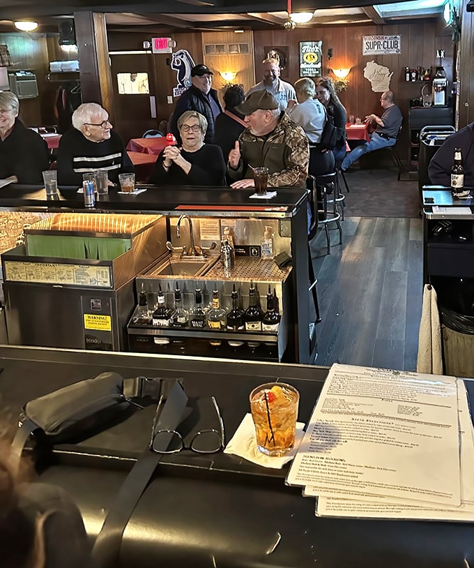 The bar area serves as Toby's social headquarters, where strangers become friends over cocktails while waiting for that coveted table.