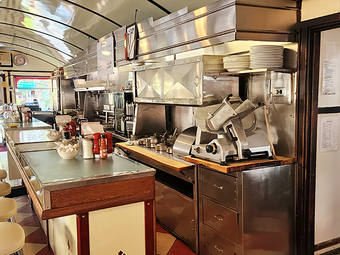 The kitchen line gleams with decades of short-order expertise, where stainless steel meets efficiency in a dance as old as diners themselves.