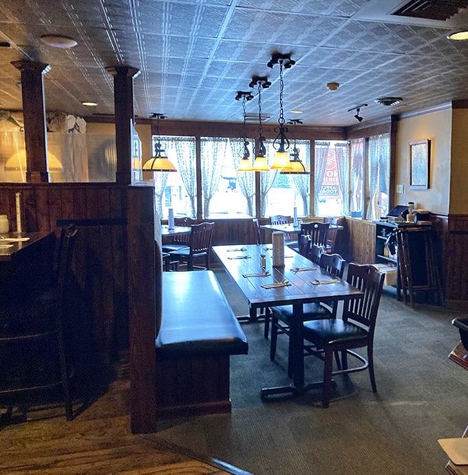 The dining room feels like the world's coziest Alpine cabin, where every wooden beam and pendant light seems to whisper, "Stay awhile."