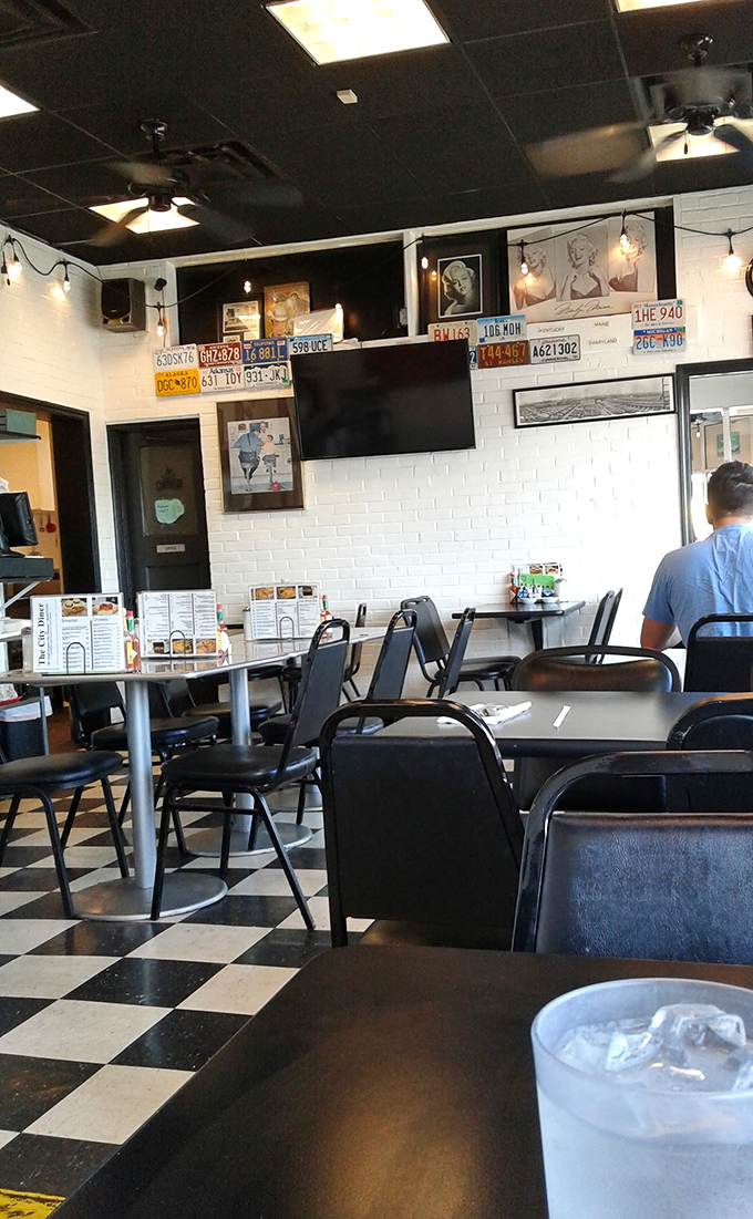 License plates and vintage photos line the walls, telling stories without saying a word. The best diners are time machines disguised as restaurants.