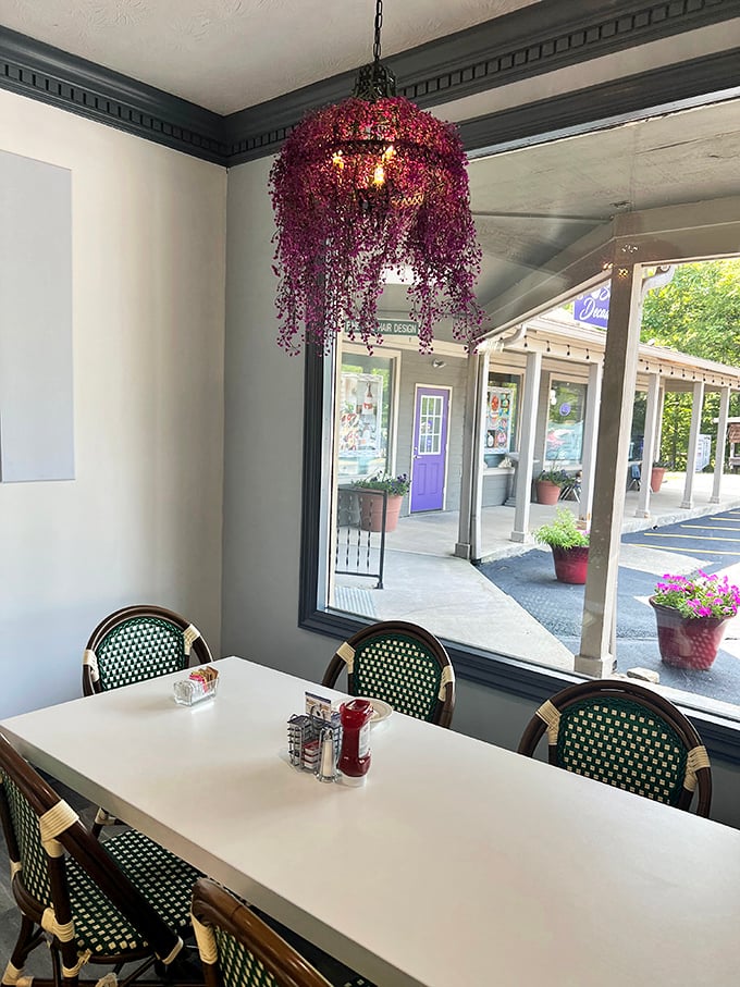 Cheerful chandeliers and window views make every meal feel like a special occasion worth celebrating.
