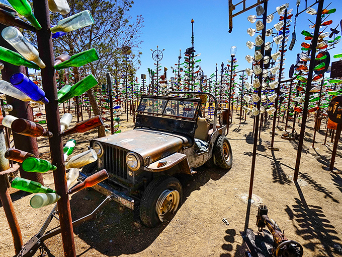 This old Jeep looks like it drove straight out of a WWII movie and parked permanently in bottle paradise.