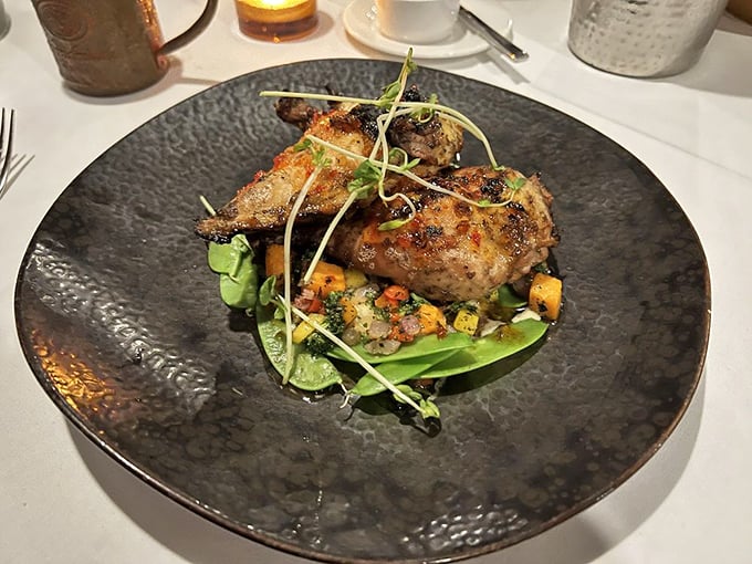 Jerk chicken that balances heat and sweet with the precision of a tightrope walker, nestled on a bed of vibrant vegetables.