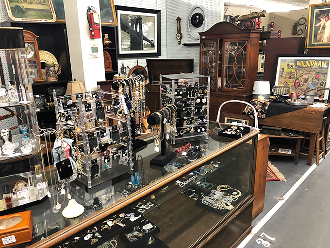 Vintage jewelry sparkles behind glass like captured starlight from more glamorous decades past.