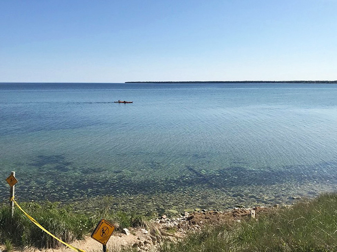 Solitude on sapphire waters. A lone kayaker discovers what explorers have known for centuries&mdash;the best views of Wisconsin come from offshore.