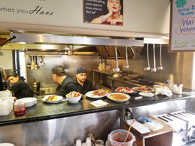 The kitchen ballet in full swing. Where breakfast dreams are constructed with precision, speed, and just the right amount of sizzle.