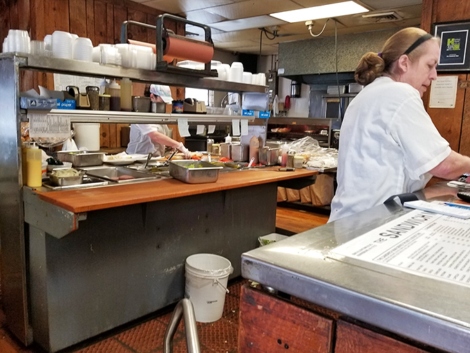 The kitchen ballet at Sandwich Man is a well-rehearsed performance where every slice, spread, and stack contributes to sandwich perfection.