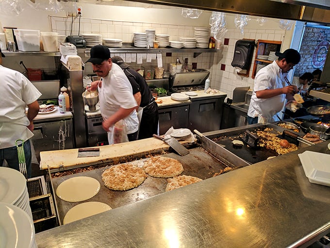 The open kitchen reveals breakfast wizards turning simple ingredients into morning magic before your very eyes.