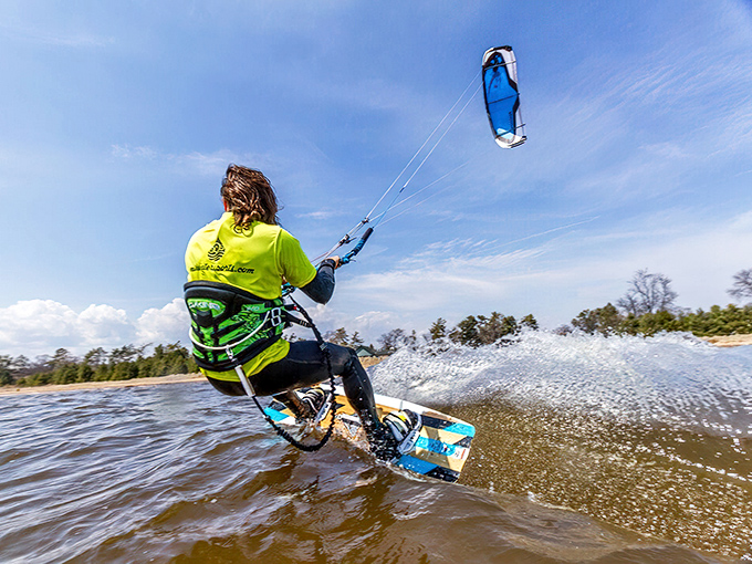 Who needs Malibu? Kiteboarding on Little Bay de Noc offers comparable thrills at one-fifth the attitude and one-tenth the housing costs.