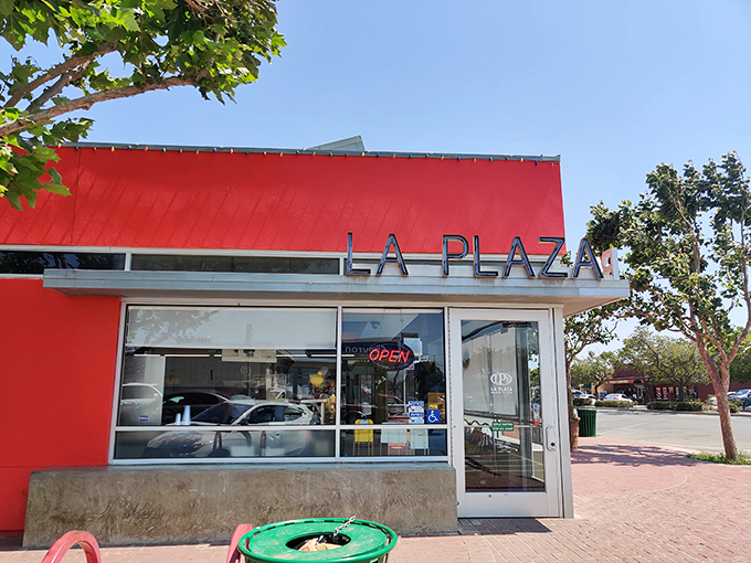 La Plaza's vibrant red fa&ccedil;ade promises authentic flavors inside&mdash;the kind of place where calories don't count because they're too delicious.