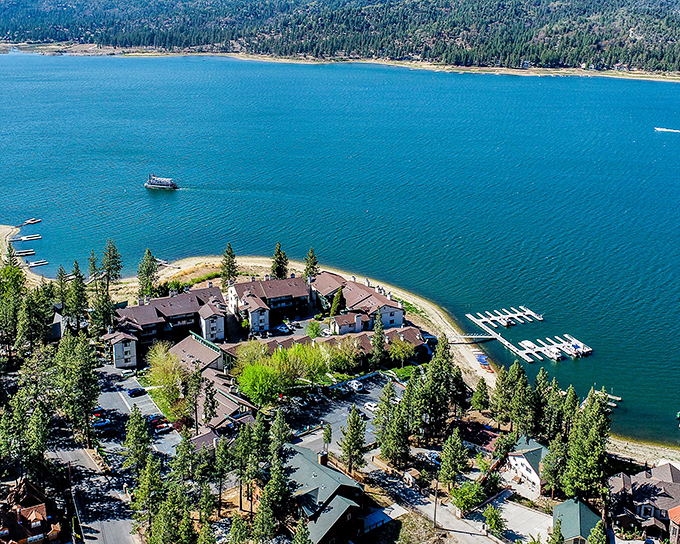 Lakeside resorts nestle among pines like architectural chameleons, offering front-row seats to nature's greatest show: absolutely nothing happening, gloriously.