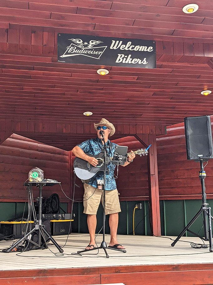 Live music under wooden beams&mdash;because nothing pairs with BBQ quite like acoustic tunes and a "Welcome Bikers" sign.