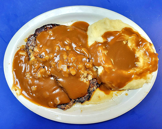 Comfort food that grandparents understand. This liver and onions swimming in gravy isn't just a meal—it's a time machine.