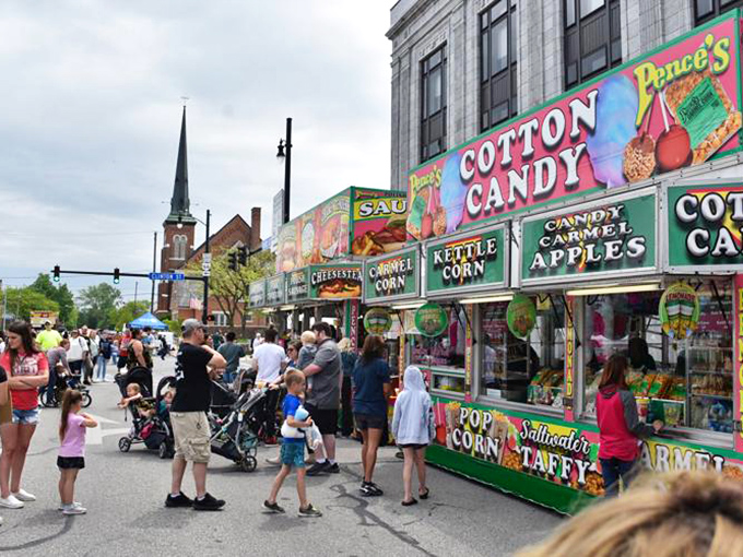 Festival food vendors line the streets during community celebrations, proving that calories consumed during special events mysteriously don't count.