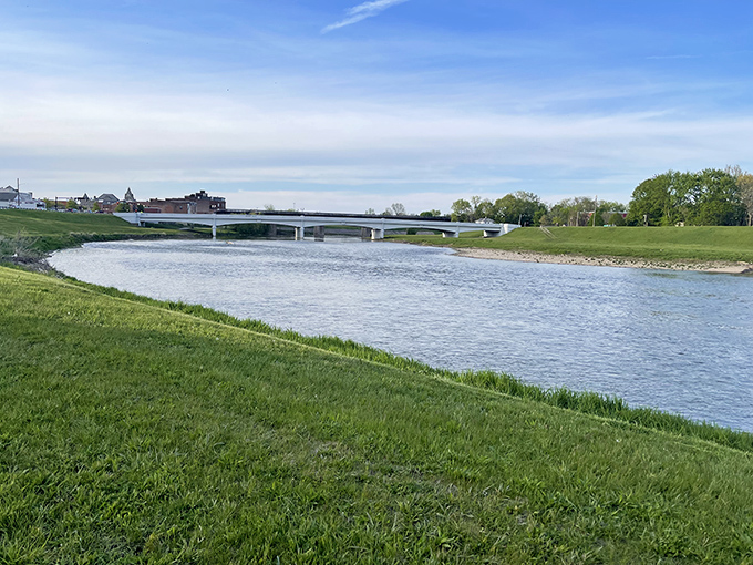 The Great Miami River flows peacefully under this bridge, offering a daily reminder that nature's best entertainment is absolutely free.