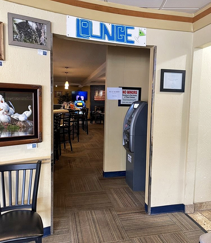 The lounge entrance beckons with blue neon promise &ndash; where breakfast can seamlessly transition to something a little stronger if your morning demands it.