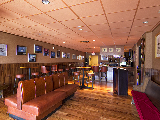 The lounge area whispers, "Stay awhile," with its warm wood tones and cozy booth seating &ndash; a sanctuary for carb enthusiasts.