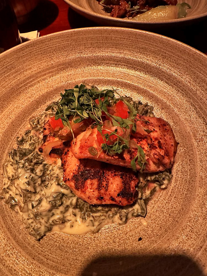 Mahi-mahi cooked to perfection, resting on a creamy sauce that would make Neptune himself request seconds.