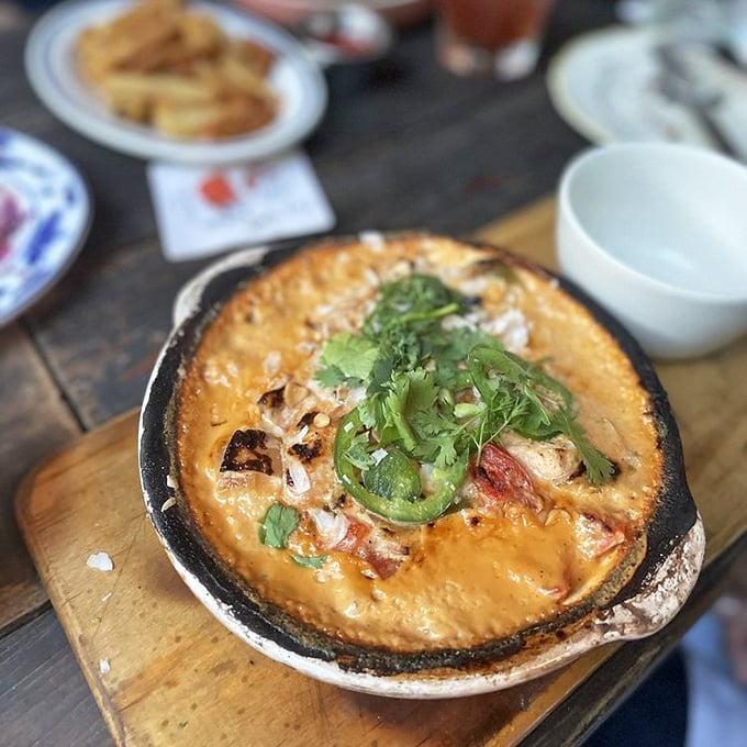 The Moqueca Stew arrives bubbling with promise&mdash;a Brazilian-inspired seafood symphony that makes you forget you're hundreds of miles from any coast.