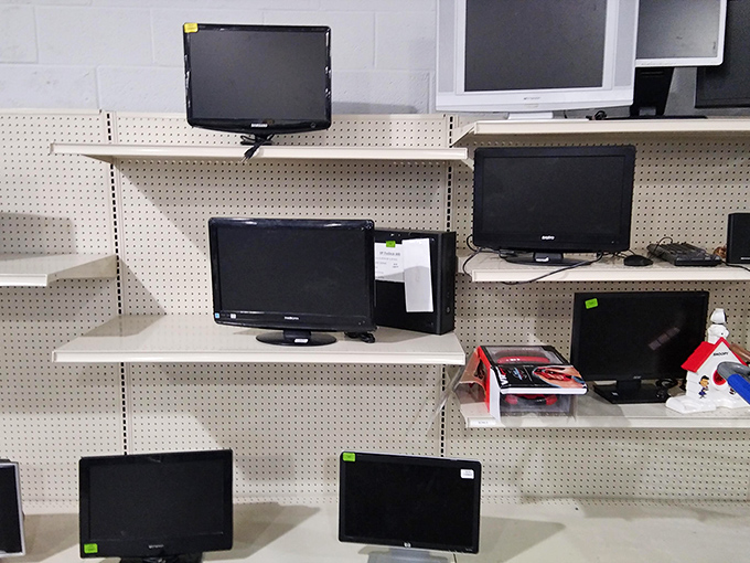 The monitor section resembles a museum of screen technology. Each display once showcased someone's favorite shows before finding its way here.