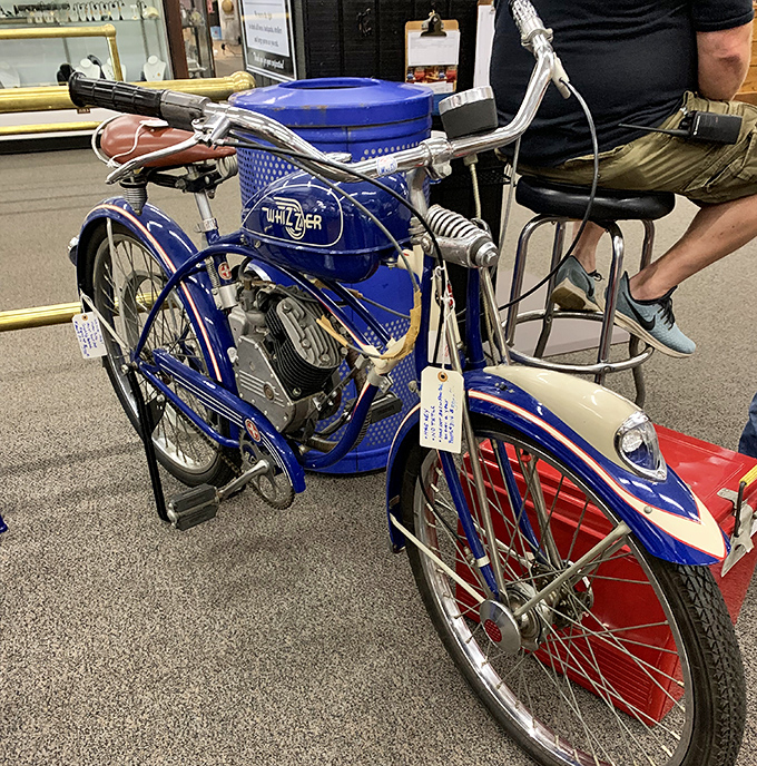 This gleaming blue Whizzer motorcycle isn't just transportation&mdash;it's a time machine on two wheels, ready to zoom back to simpler days.