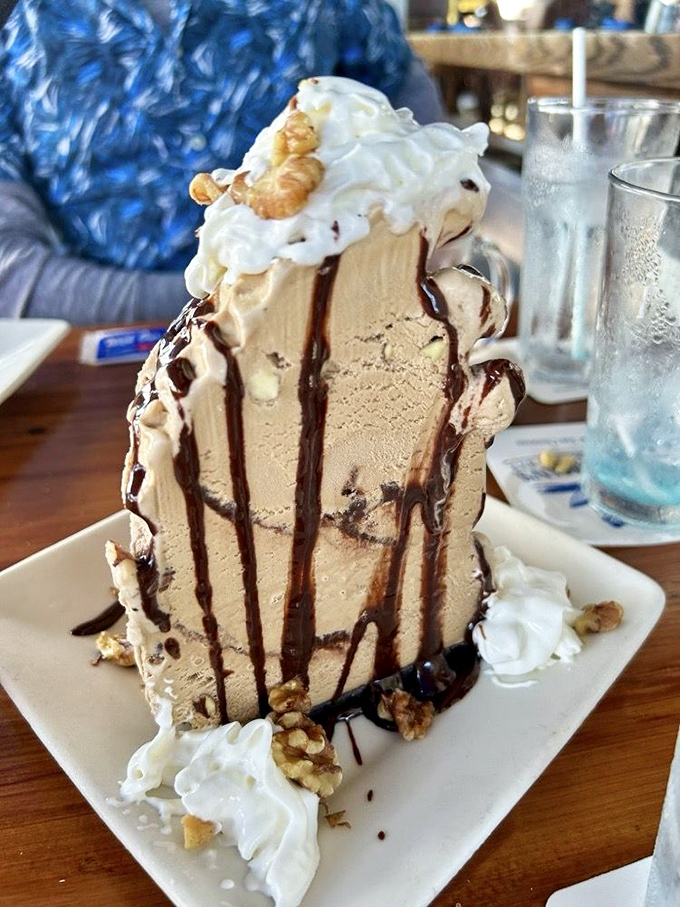 A mud pie that defies gravity and good sense. This towering dessert isn't just a sweet ending&mdash;it's a chocolate-drizzled monument to indulgence.