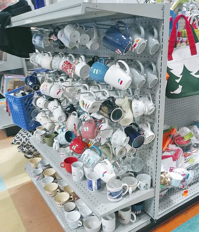 The mug wall: where coffee vessels of every conceivable design and decade congregate in ceramic harmony.