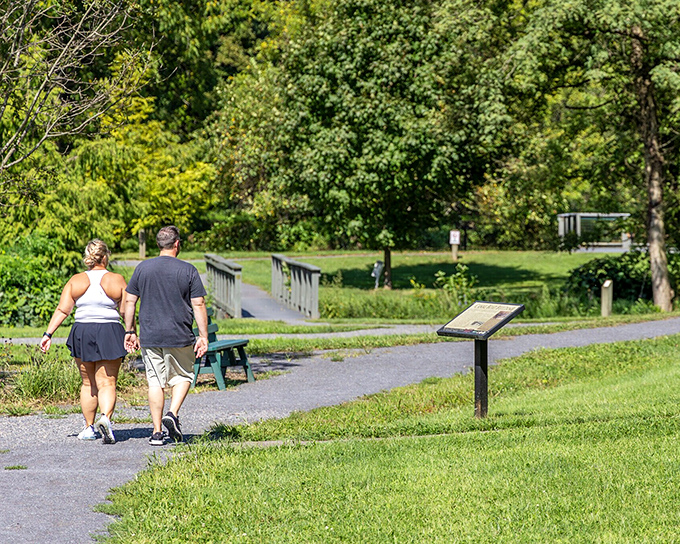 Heritage Park's walking paths invite couples to stroll hand-in-hand through nature's gallery, no admission fee required.