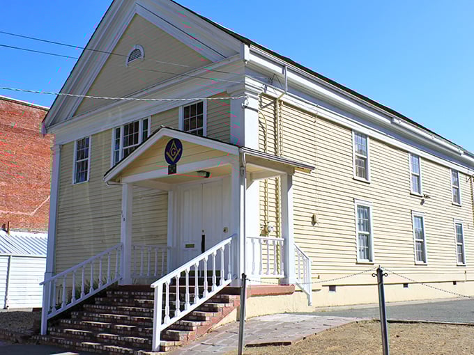 The Masonic Hall's simple yellow exterior belies its historical significance&mdash;like finding out your quiet neighbor used to be a rock star.