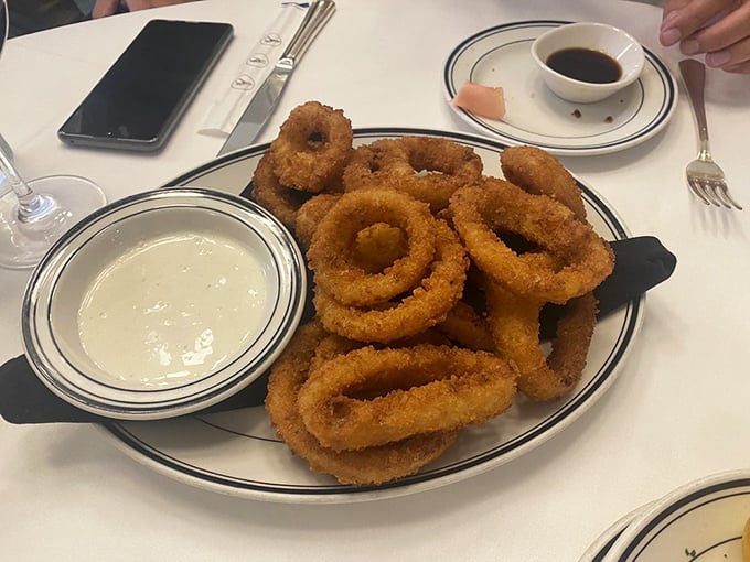 Onion rings with the structural integrity of Olympic gold medals&mdash;crispy, golden halos that make you wonder why anyone bothers with lesser side dishes.