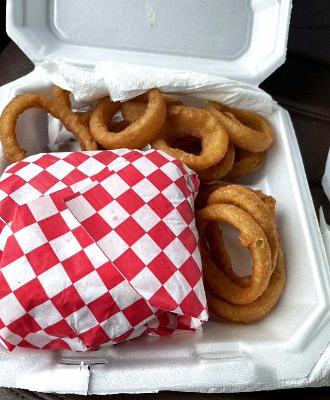 Onion rings that shatter with each bite, revealing sweet onion inside. The perfect circle of flavor that complements everything on the menu.