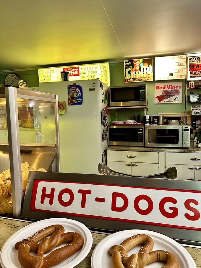 Hot dogs under heat lamps await their starring role in your evening's feast&mdash;the supporting cast to the main feature flickering on screen